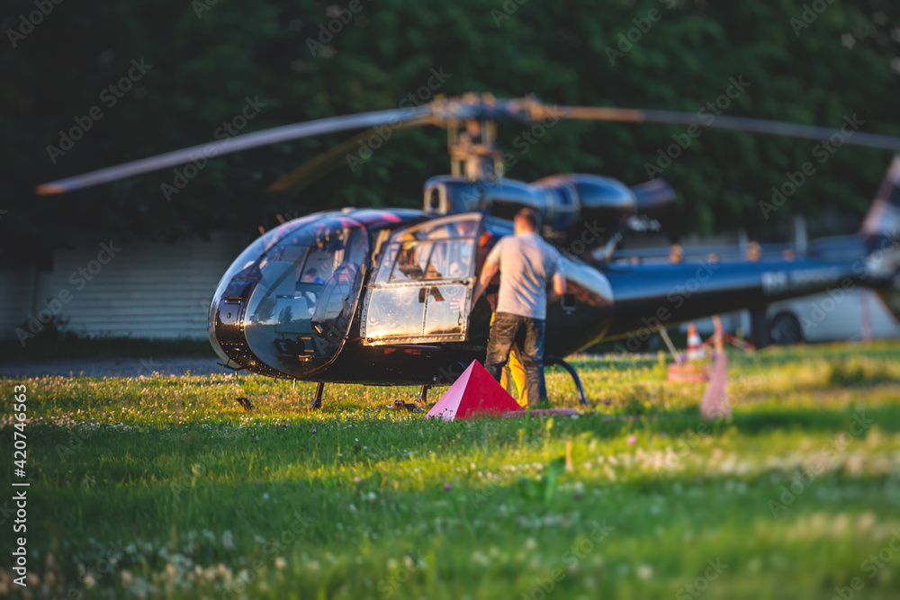 Civil black helicopter getting ready to fly, commercial charter private ...