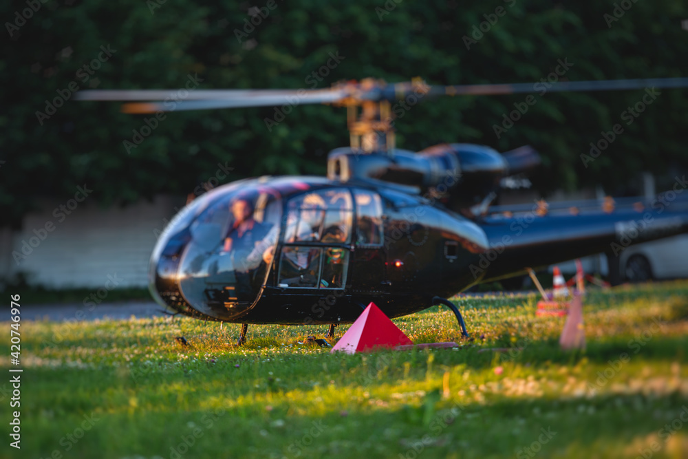 Civil black helicopter getting ready to fly, commercial charter private ...