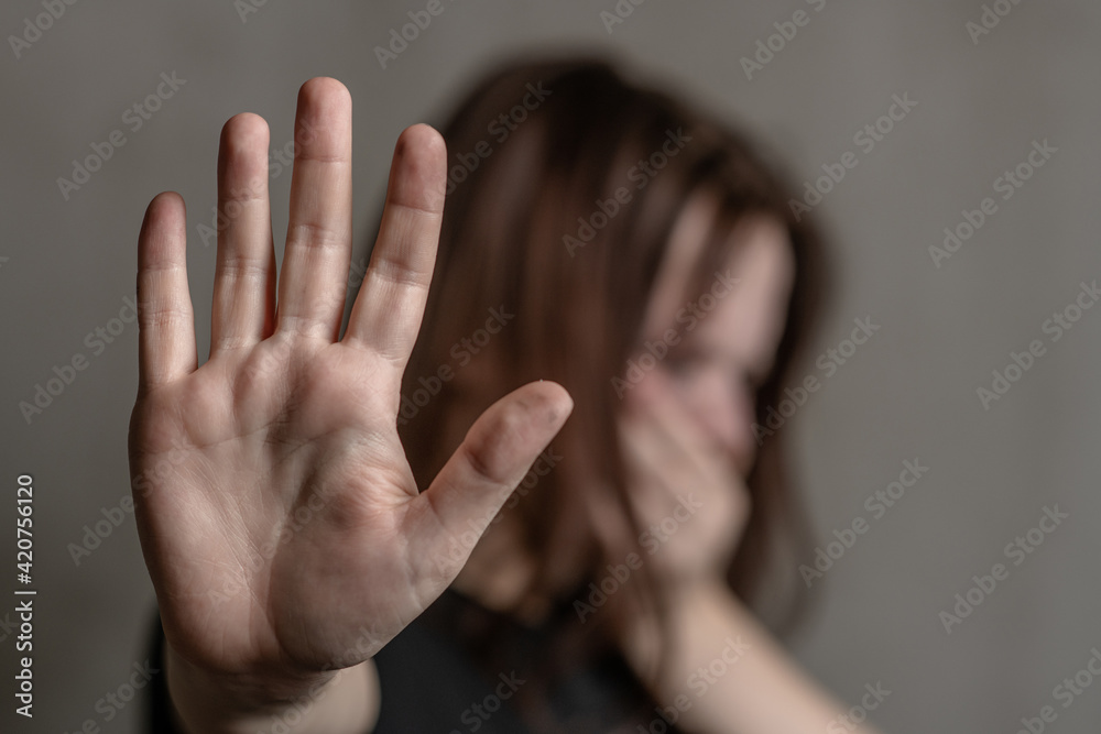 Crying teenage girl showing a stop sign with her hand Stock Photo ...