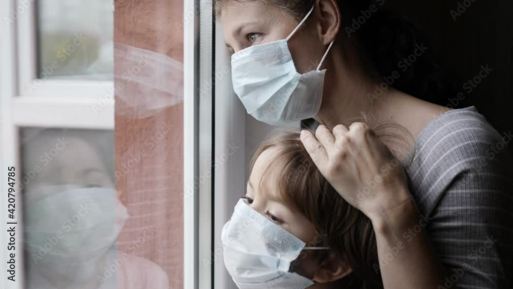 Mature Woman With Her Son, With Protective Mask, Sad Looking Through ...
