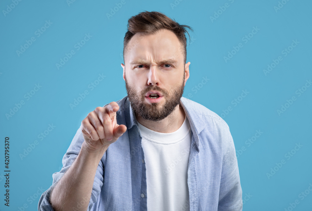 It is your fault. Angry Caucasian man pointing finger at screen in ...