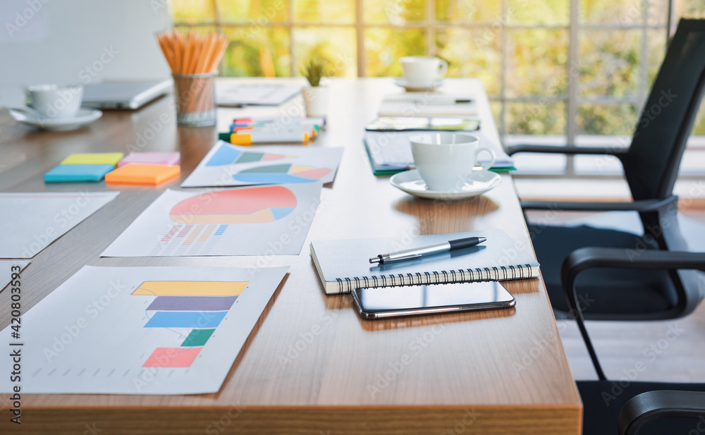 Office table with blank notepad and laptop. Messy office desk. Artist ...