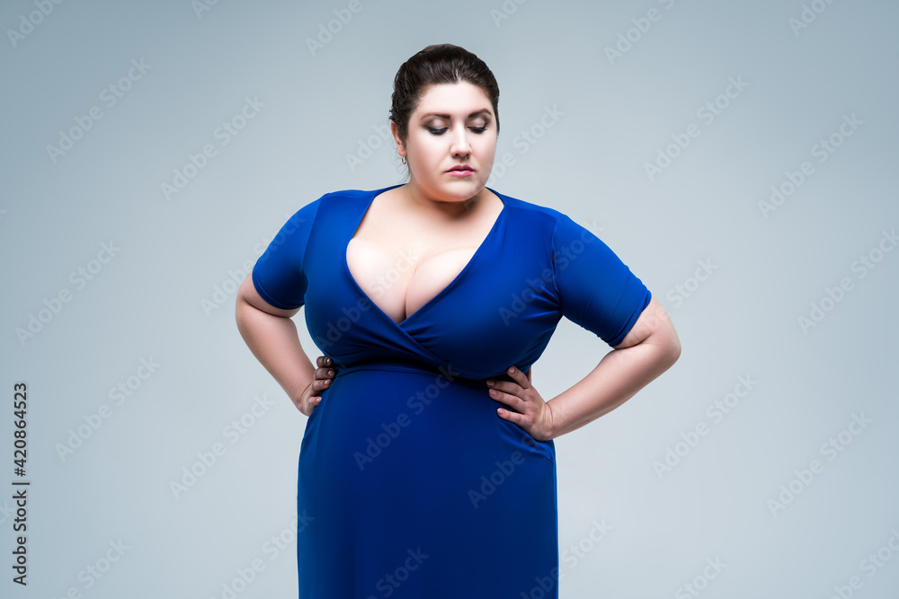 Sexy Plus Size Fashion Model In Blue Dress With Deep Neckline Fat