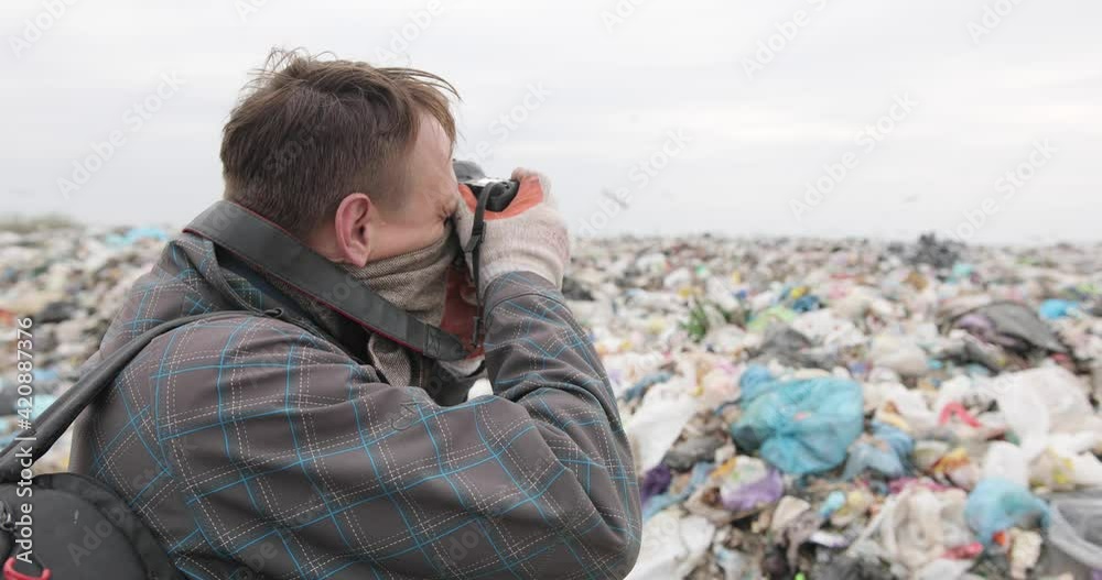 Photographer make photo at the landfill. Mountain garbage, large and ...