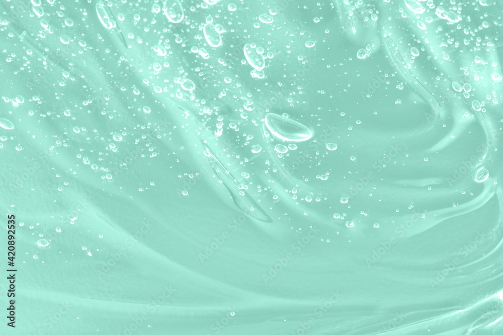 Skincare moisturizing product. Liquid green oil smudge. The concept of ...