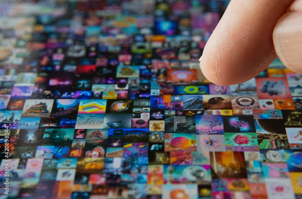 Finger pointing at tablet screen with Beeple pattern " EVERYDAYS: THE ...
