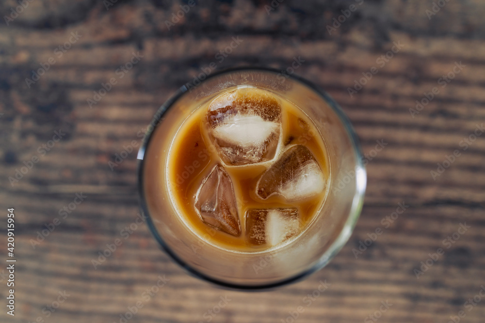 cold brew coffee with ice cubes in glass from topdown view., drinks and ...