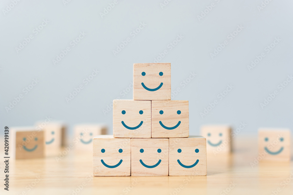 Wooden cube block shape with icon face smiley, The best excellent ...