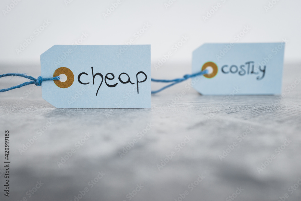 Cheap vs Costly prioduct price tags next to each other symbol of options for the customer, money ...