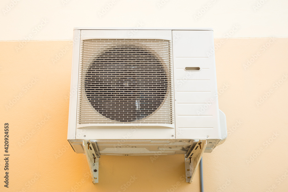 Condenser unit or compressor outside home or residential building. Unit ...