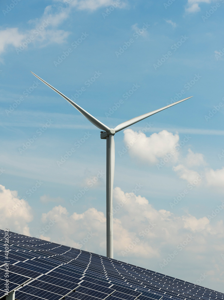 Solar panels and wind turbines, solar field, on a former waste dump ...