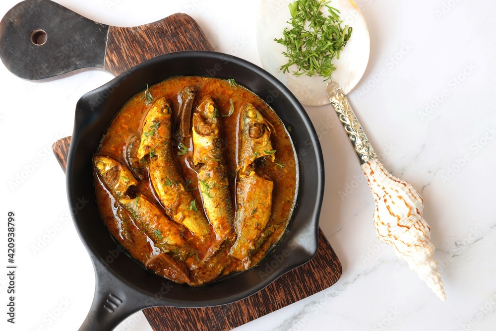 Indian fish curry. White Mullet fish curry made with dried mango and ...