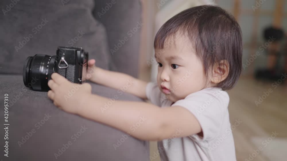 Happy adorable cute little preschool child girl playing with dad's ...