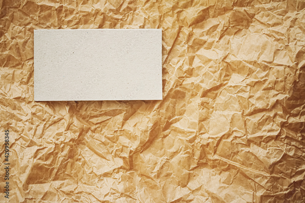 White business card flatlay on brown parchment paper background, luxury ...
