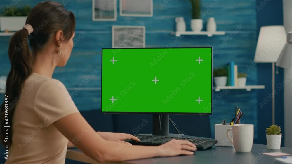 Beautiful caucasian woman working on green screen mock up PC with ...