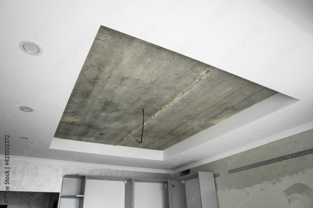 The ceiling in the kitchen is prepared for the installation of a ...