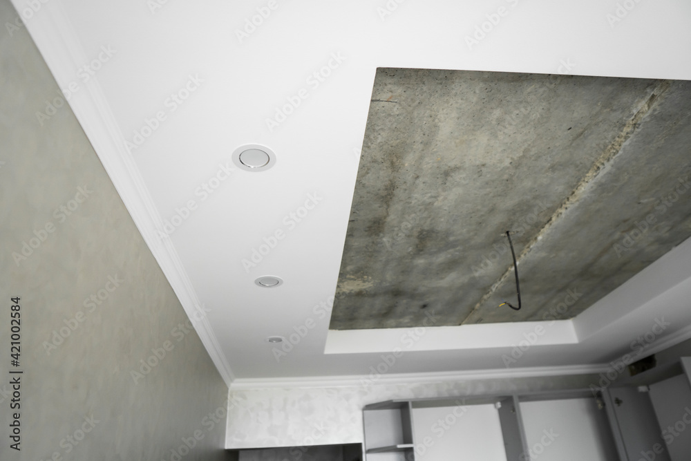 The ceiling in the kitchen is prepared for the installation of a ...