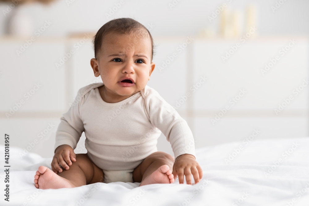 Portrait of sad black baby crying alone Stock Photo | Adobe Stock