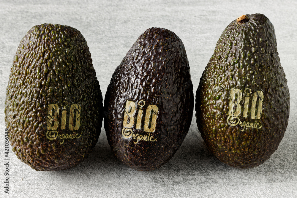 Bio Organic hass avocado fruits with laser labelling. Stock Photo ...