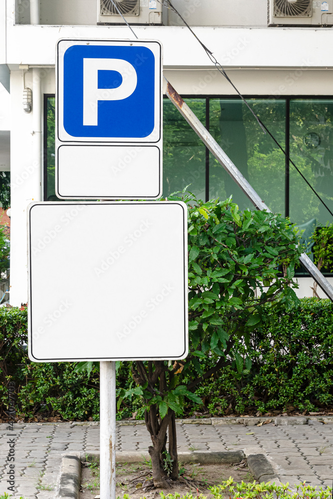 The blue parking sign and empty white blank road sign board in the ...