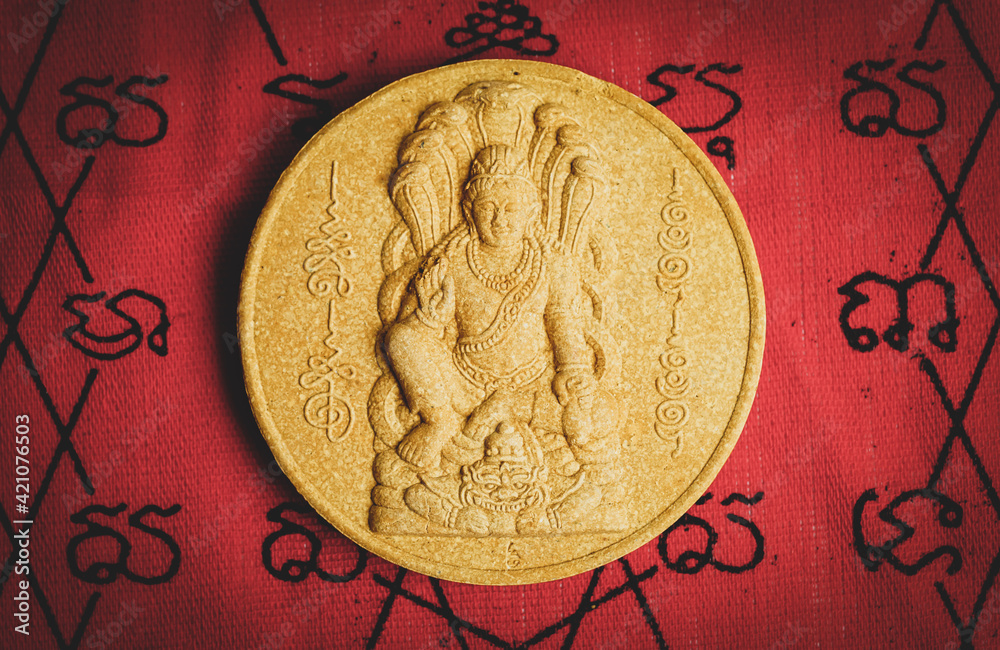 Thai amulets with a talisman background.Jatukham. Stock Photo | Adobe Stock