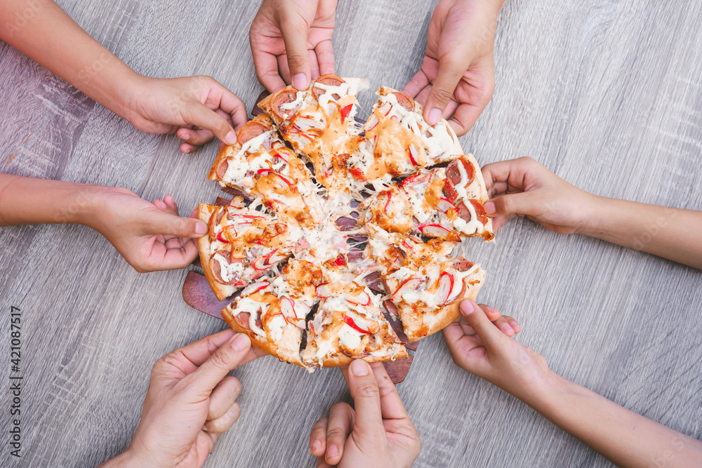 Pizza and hands concept, slices pizza portion for group people show ...