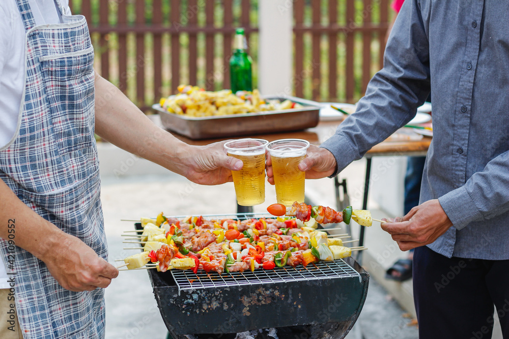 Foto de Blurred images ,Barbecue party (BBQ) After work to celebrate ...