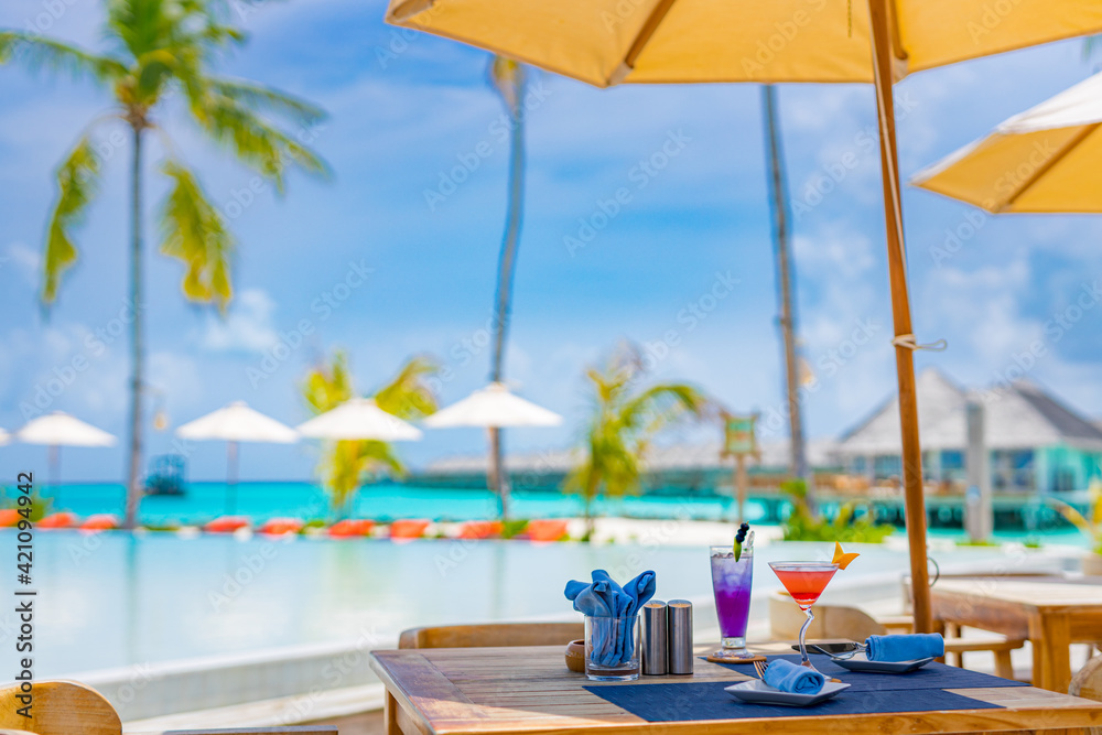 Luxury resort hotel poolside, outdoor restaurant on the beach, ocean ...
