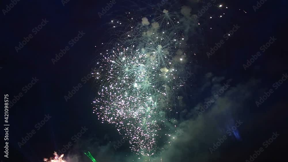 firework, huge balls of fire scatter into billions of multi-colored ...