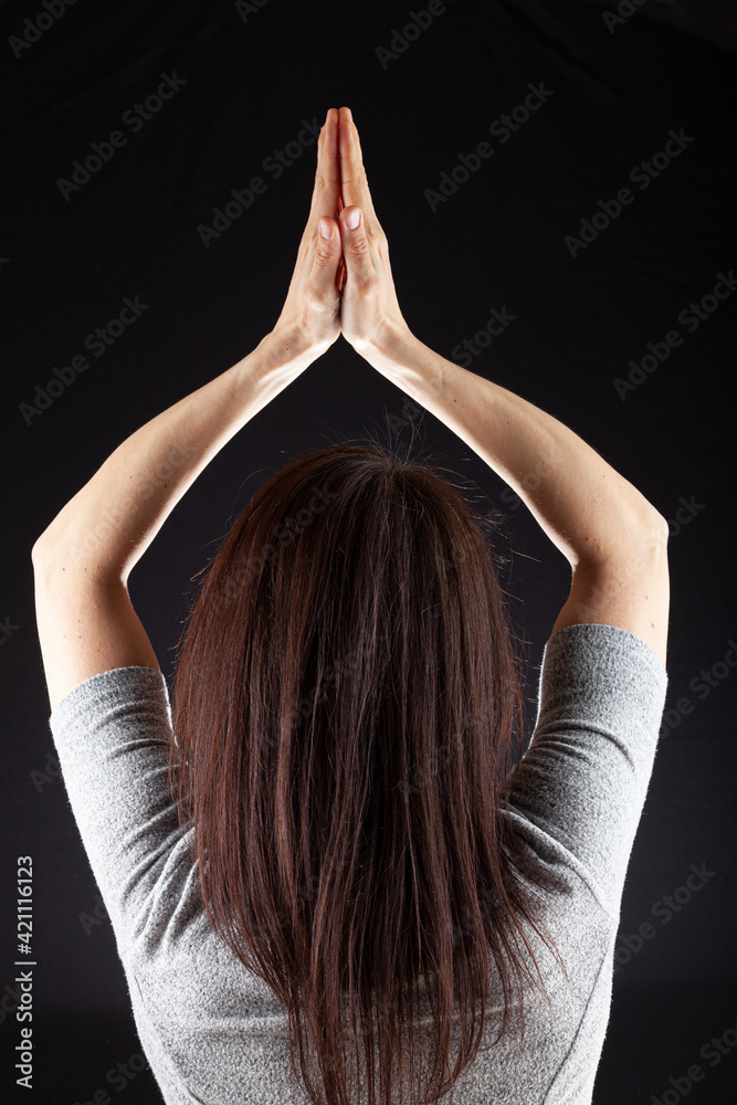 Rim lighted, behind the head view of a young caucasian woman with long ...