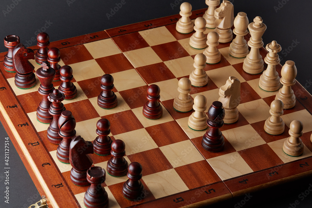 Classic Wooden Tournament chess set on black background. Chessboard ...