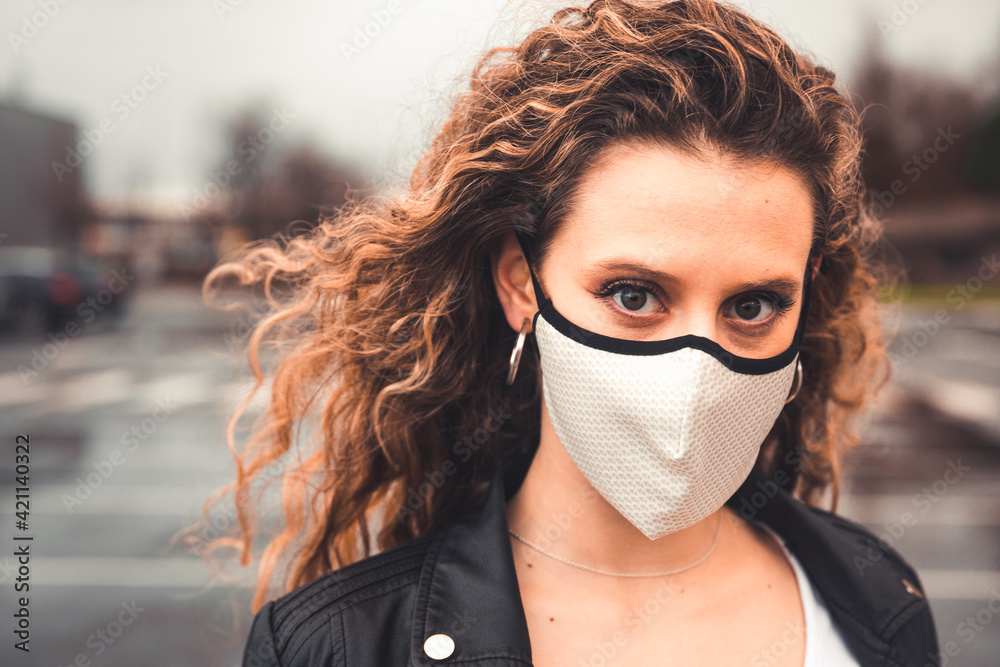 Young sexy woman with a white mask on a parking lot Stock Photo | Adobe ...