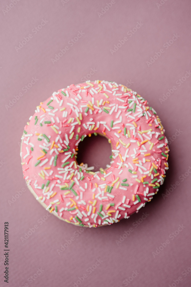 pink donut with sprinkles on pink background Stock Photo | Adobe Stock