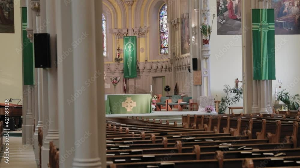 Walking on the outer sanctuary wall passing by the beautiful pews and ...