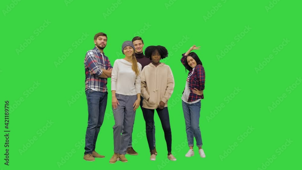 Young kids posing for a full size picture, looking funny on a Green ...