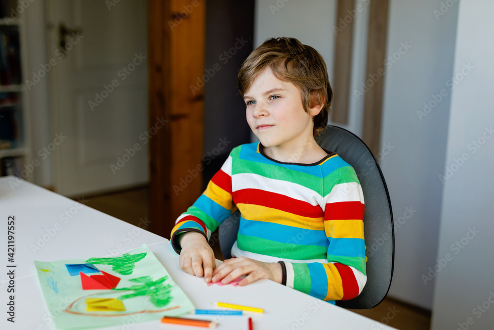 Little kid boy making paper origami tulip flowers for a postcard for ...
