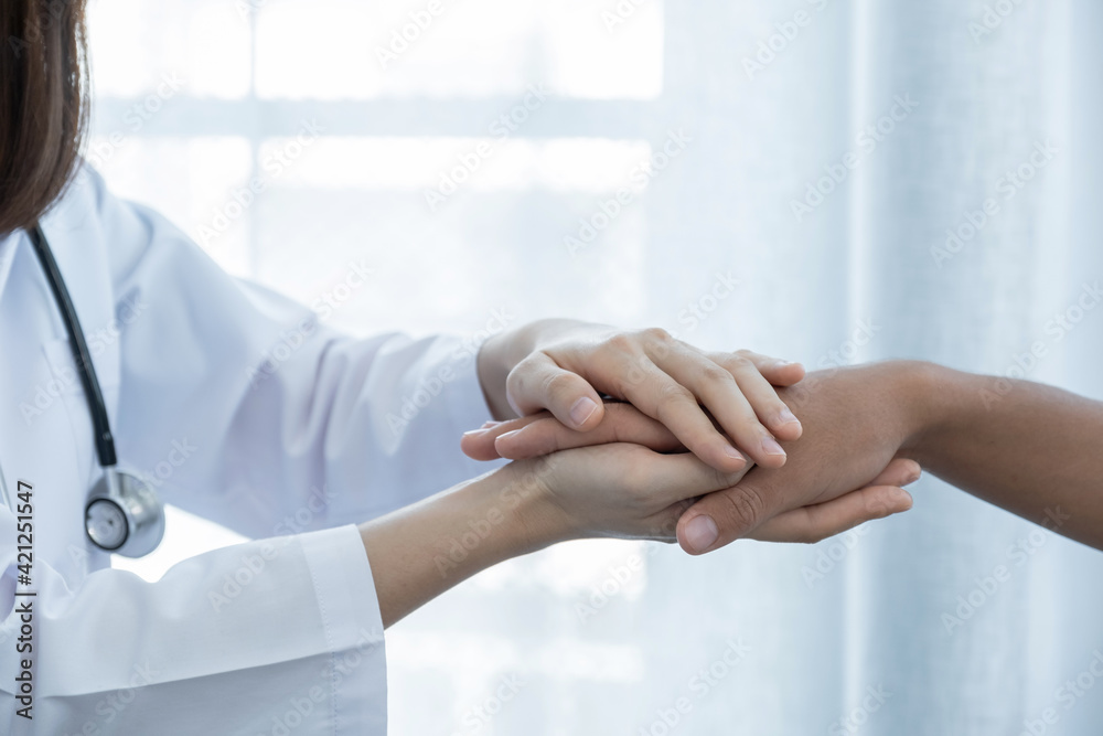 The doctor hands holding patient hand to encouragement and explained ...