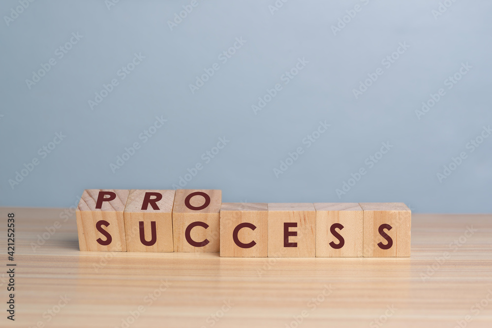 Success process symbol. Turned wooden cubes and changed the word ...