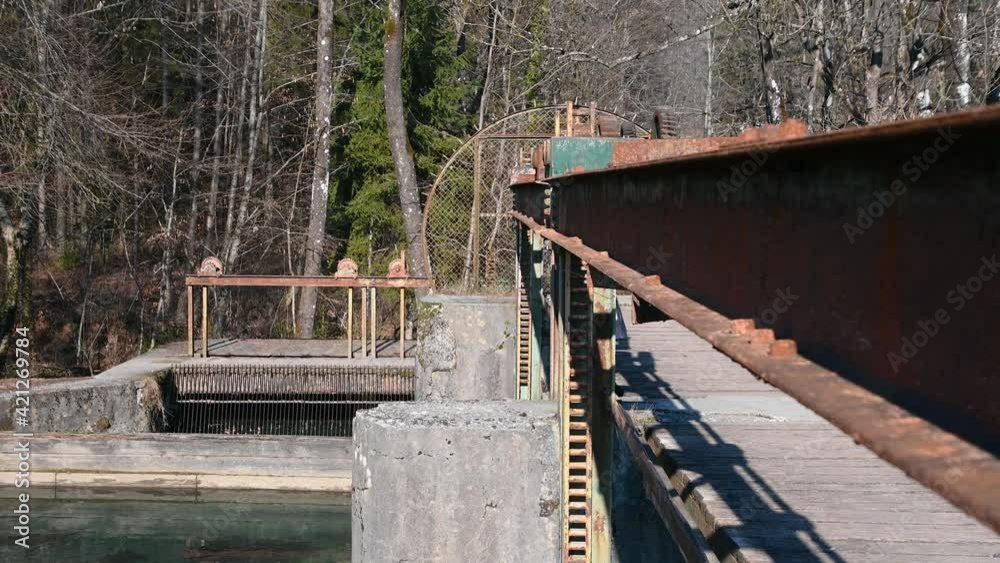 Small concrete dam on Alpine river in Slovenia. Rural water retention ...