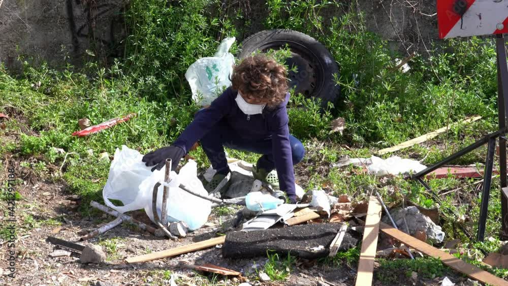 Boy 6-year-old children collect polluting garbage on city streets ...