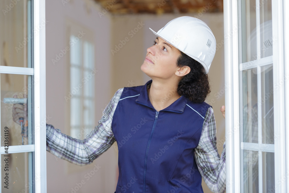 woman installing bay window in a new house construction site Stock ...
