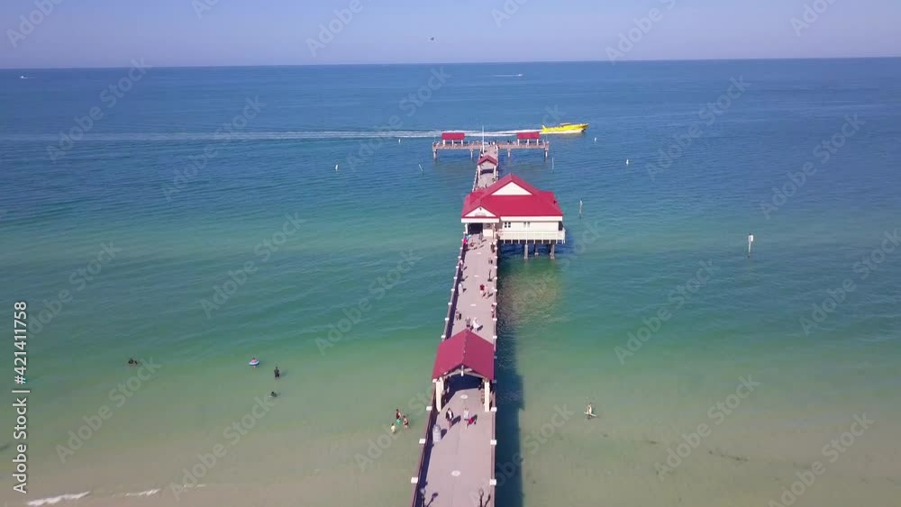 Fishing pier. Spring break or summer vacations. Ocean beach. Gulf of ...