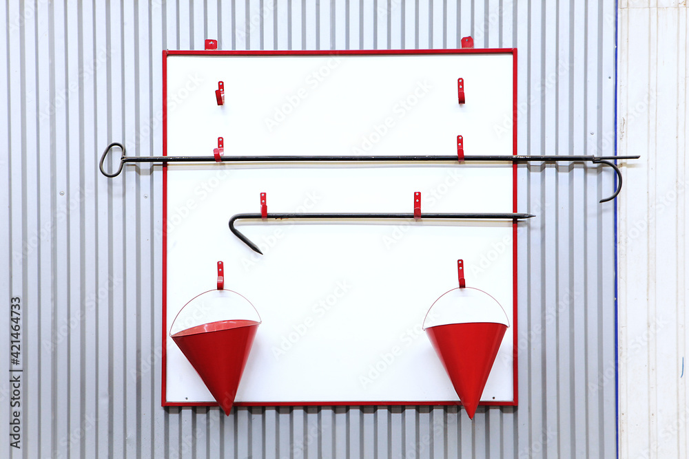 Items for ensuring fire safety in the workplace. Fire-fighting stand at ...