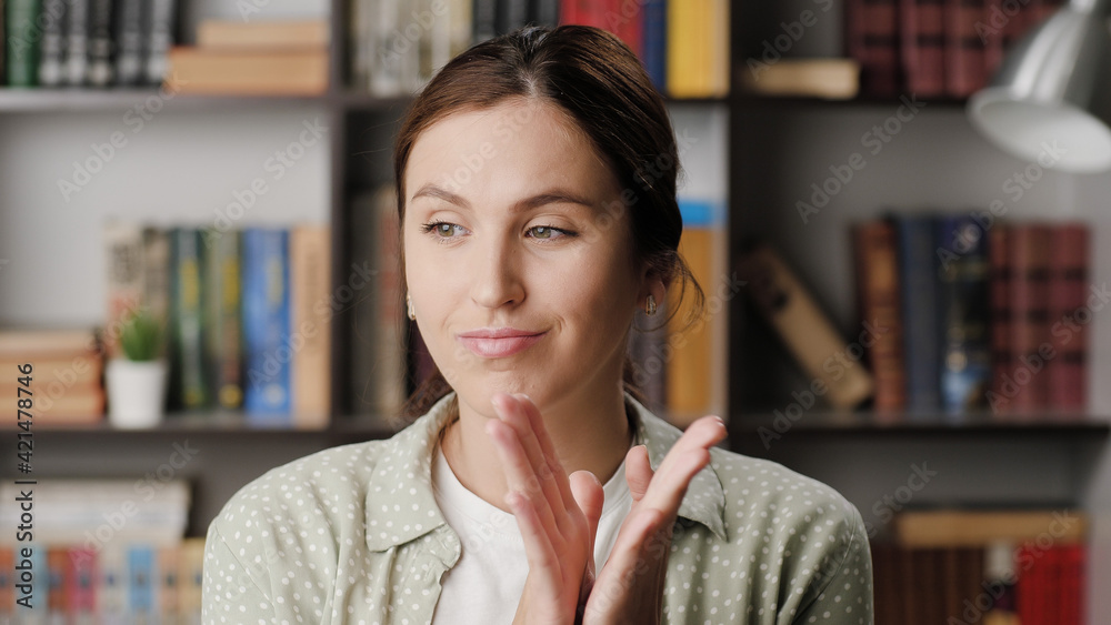 Woman sarcastic applause. Gloomy skeptical woman in office or apartment ...