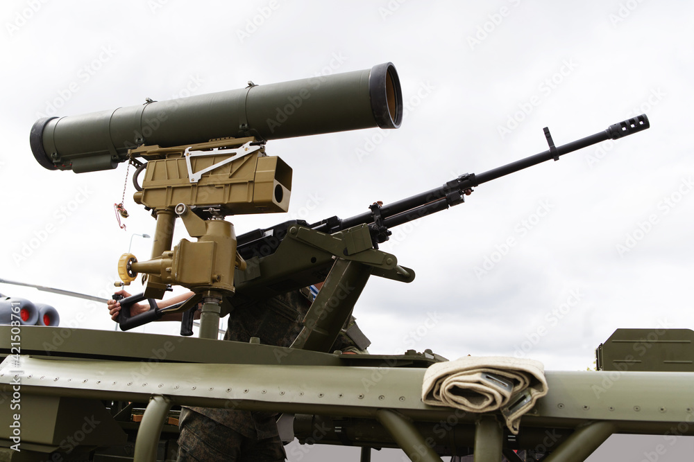 Firearms on the roof of a military vehicle. Machine gun and grenade ...