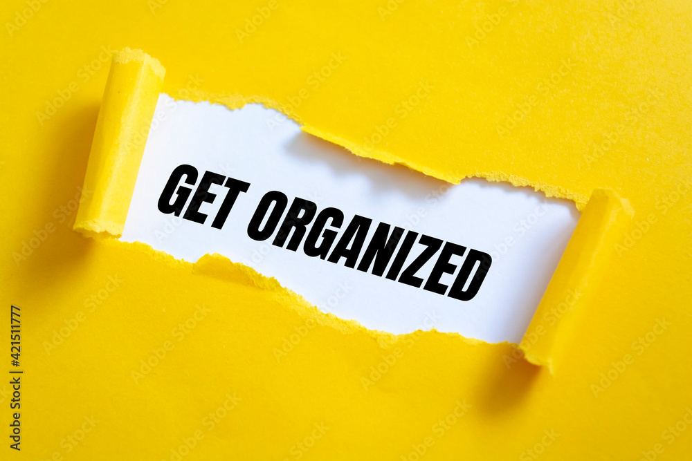 Torn yellow paper revealing the words Get organized Stock Photo | Adobe ...