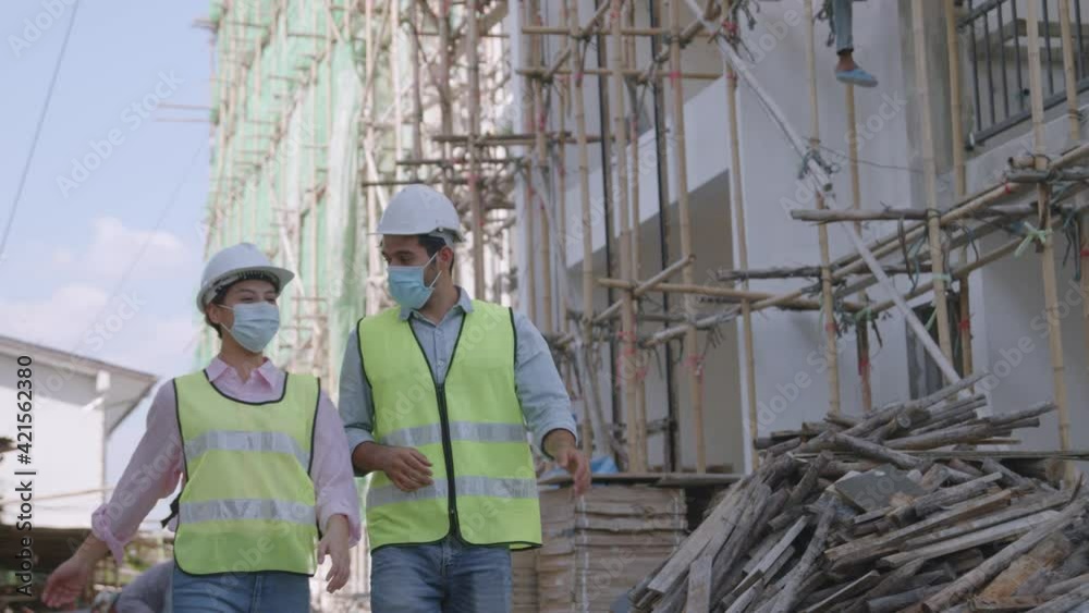 The engineering team walks out of the construction site and says ...