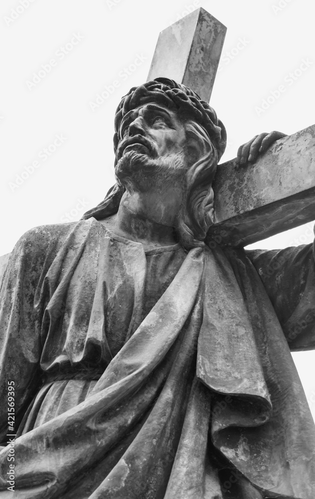 Bottom view of holy cross with crucified Jesus Christ. Ancient statue ...