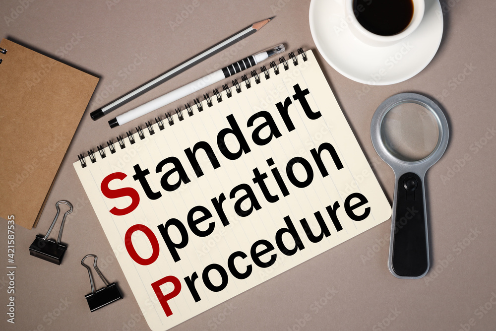 SOP as Standard Operating Procedure. text on white paper on brown ...