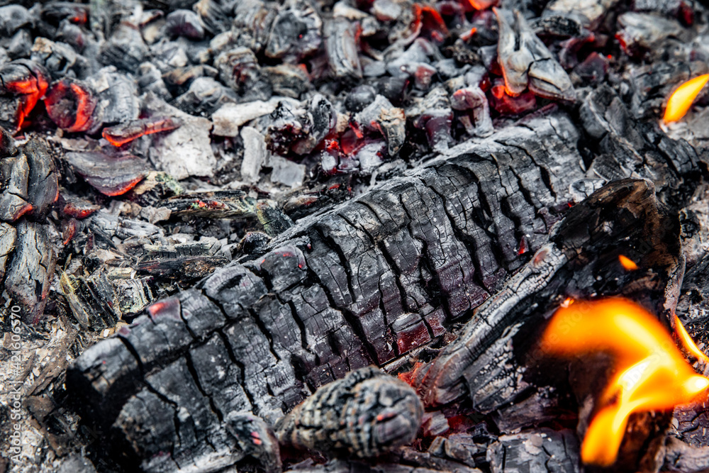 Glowing embers in hot red color, abstract background. The hot embers of ...